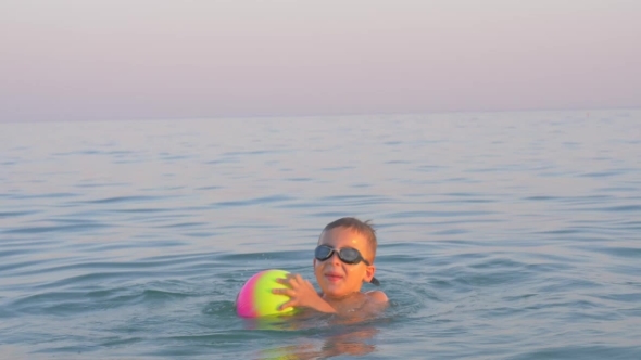 Happy Child Bathing in the Sea with Ball, Stock Footage | VideoHive