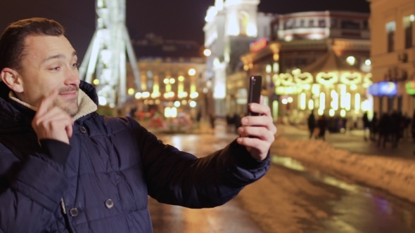 Handsome Man Has a Video Call at Night City Background, Stock Footage