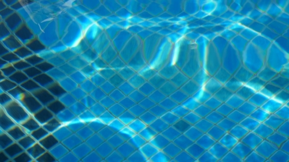 In the Pool, the Rays of the Sun Are Reflected in the Waves of Water ...