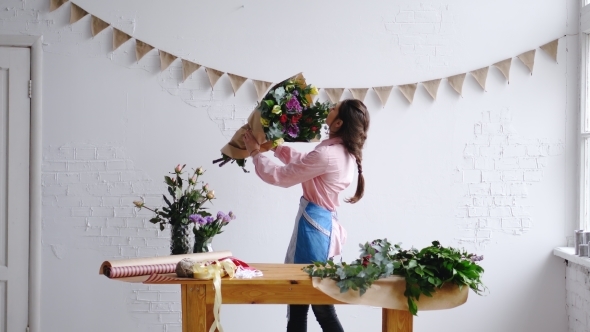 Florist Wrapping Big and Modern Bouquet of Flowers in Paper at Flower ...
