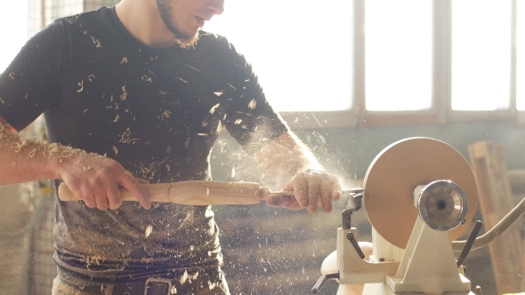 Attractive Carpenter Working on Woodworking Lathe Machine in The ...