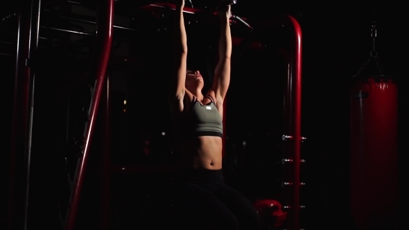 Fitness Woman Performing Hanging Leg Raises Exercise - One Of The Most ...