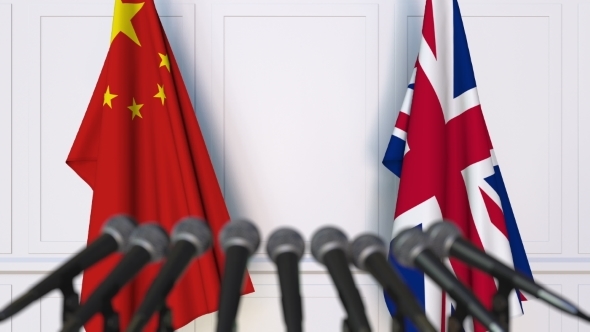 Flags of China and The United Kingdom at International Press Conference ...