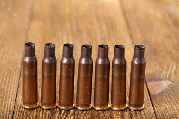 Empty rifle cartridges. Stock Photo by indigolotos | PhotoDune