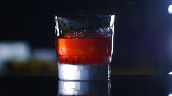 Preparing a Cocktail with Ice a Mix of Alcohol in a Nightclub or Pub ...