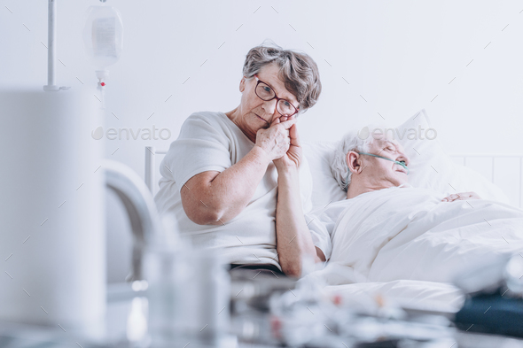 Loving wife at hospital bed Stock Photo by bialasiewicz | PhotoDune