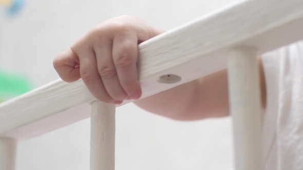 Baby Holds Hands for Baby Crib, Stock Footage | VideoHive