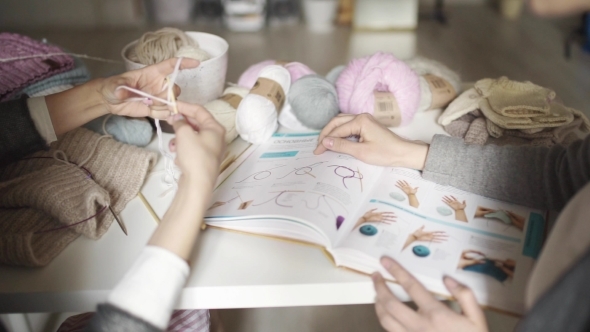 Two Creative Woman Friends Using Book with Knitting Pattern. Knitting ...
