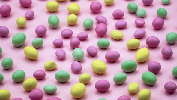 Video of Tasty Crispy Round Candies Isolated on Pink Background, Stock ...