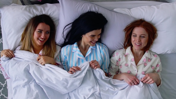 Top View Three Beautiful Girlfriends Girls Go To Bed In Cute Pajamas