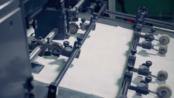 of Industrial Machine's Elements Stabilizing Pieces of Paper During ...