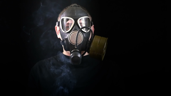 The Face of a Man in a Gas Mask on a Black Background That Protects ...
