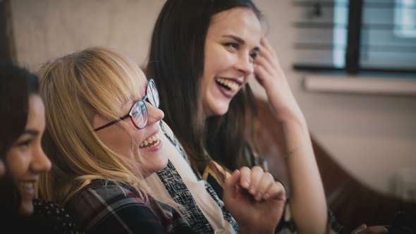 Beautiful Ladies Watch Romantic Comedy on TV. Young Caucasian Girls ...