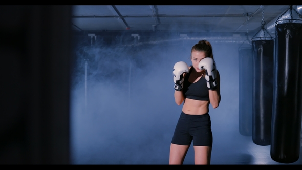 Woman Kickboxer Shadow Boxing As Exercise for the Fight, Stock Footage
