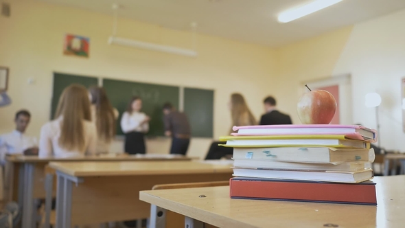 School Break in the Classroom. Books with Apple Are on the Table ...