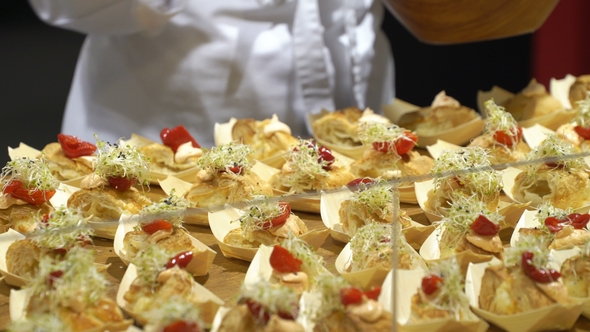 The Chefs Prepare Food Samples for Visitors During the Food Show, Stock ...