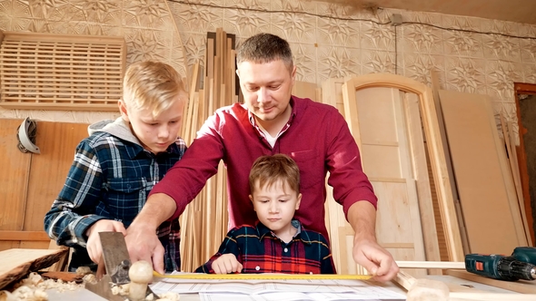 Family, Carpentry, Woodwork and People Concept Father Teaches Son ...