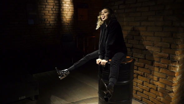 Girl Is Sitting on the Barrel, Stock Footage | VideoHive