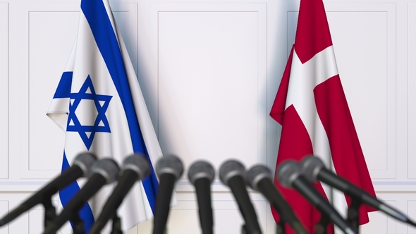 Flags of Israel and Denmark at International Press Conference, Motion ...