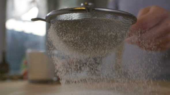 Woman Sifting Flour Through a Sieve, Stock Footage | VideoHive
