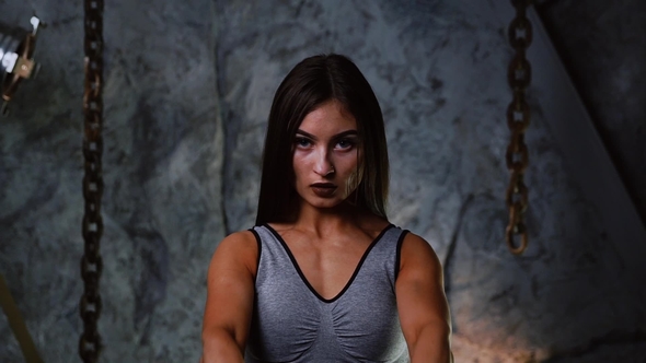 Fitness Model Doing Exercises for the Shoulders Lifting Dumbbells ...