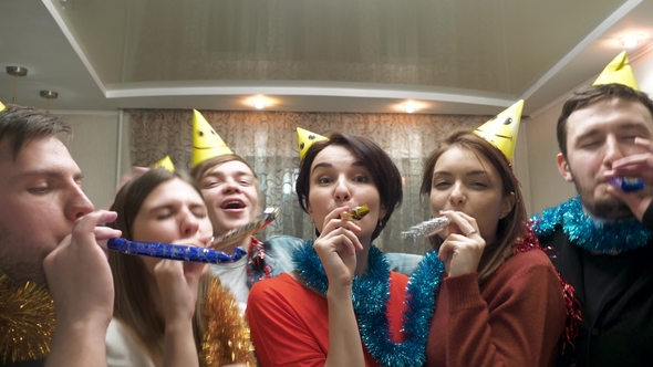 Friends with Party Hat Blowing and Having Fun. Friends with Party Hats ...