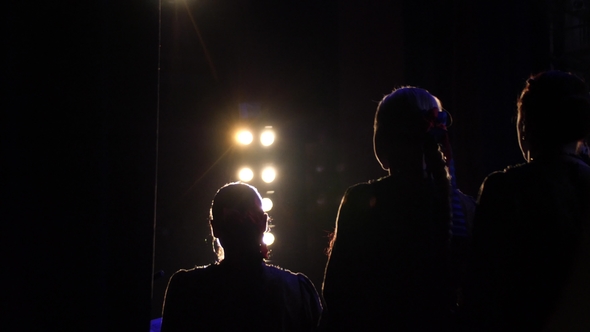 Actors On Stage With Spotlight