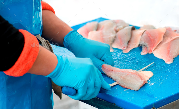 Man filleting fish in close up Stock Photo by Photology75 | PhotoDune