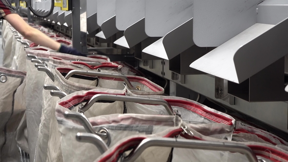 Lady Handling Parcels at Bags of the Automated Parcel Sorting System ...