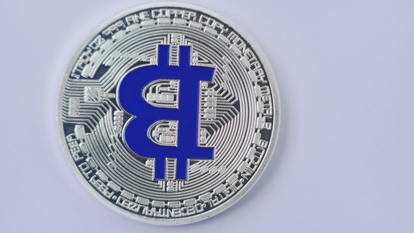 Shot of Silver Bitcoin Rotating on White Background, Stock Footage
