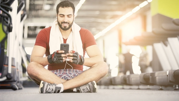 Man with Phone in Gym, Stock Footage | VideoHive
