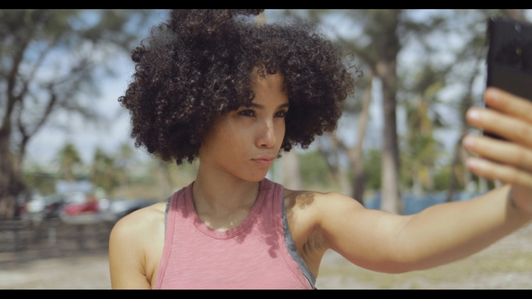 Pretty Black Girl Taking Selfie in Park, Stock Footage | VideoHive
