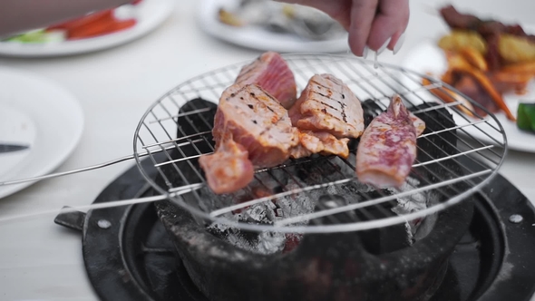 Pieces of Red Tuna Are Roasted on the Open Fire of Grill,the Cook ...