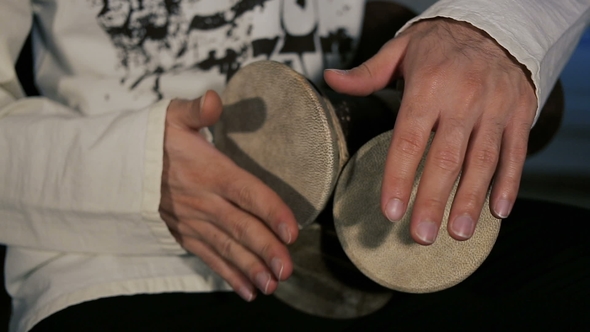 Man's Hands Drumming Out a Beat on an Arabic Percussion Drum Named ...