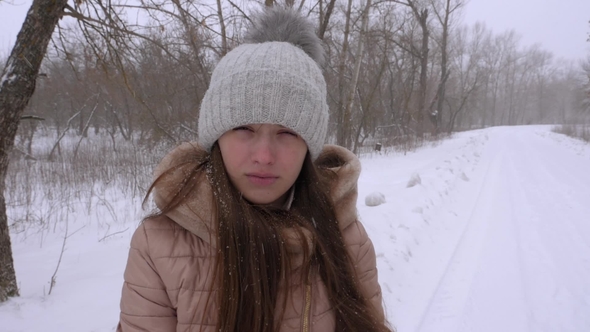 Serious Girl in Strong Snowstorm in Winter, Stock Footage | VideoHive