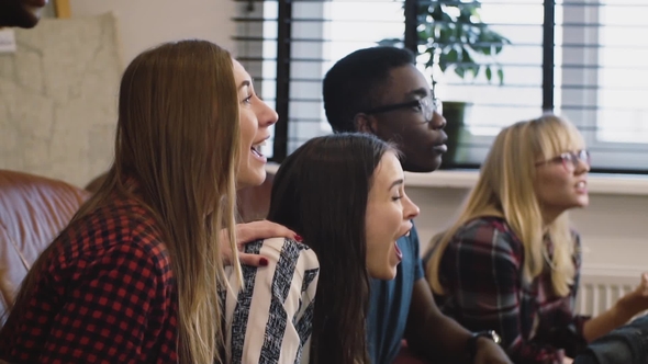 Multi-ethnic Football Fans Go Wild Celebrating Win with Confetti and ...