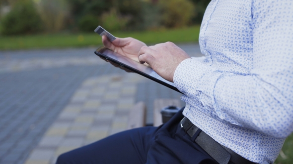 Male Hand Using Tablet and Smartphone on the Street, Stock Footage