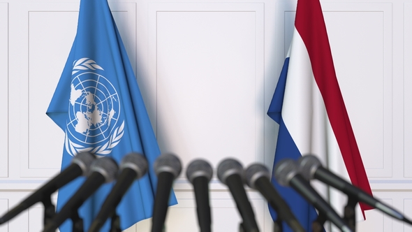 Flags of the United Nations and Netherlands at International Press ...