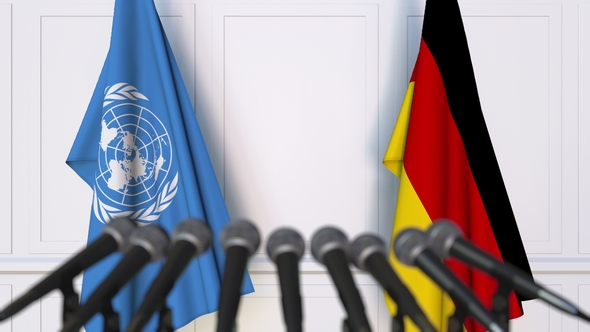 Flags of the United Nations and Germany at International Press ...