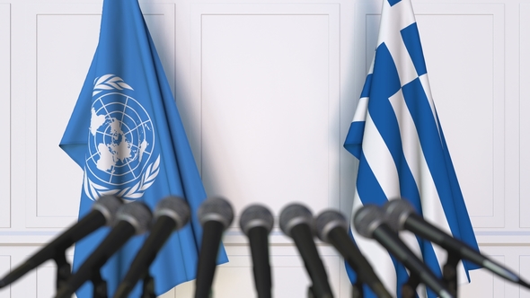 Flags of the United Nations and Greece at International Press ...