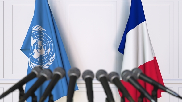 Flags of the United Nations and France at International Press ...