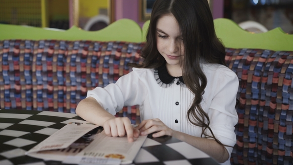 Pretty Girl Reading the Menu and Making an Order, Stock Footage | VideoHive