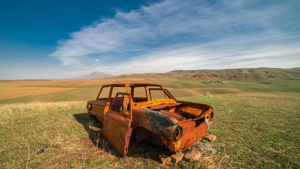 Old Orange Rust Retro Car at the Field and Blue Sky, Stock Footage