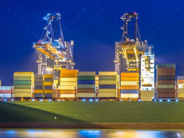 Container ship unloading in automated harbor Stock Photo by ...