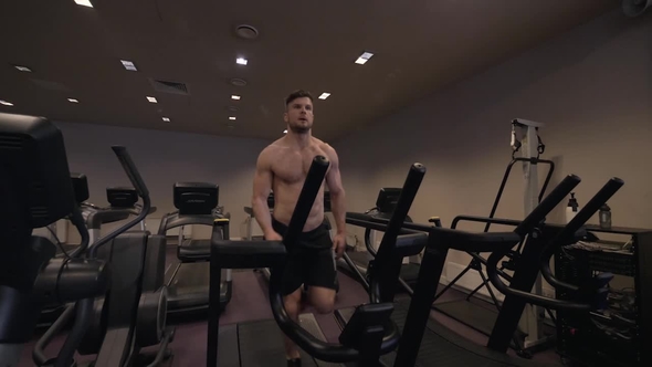 Muscular Man Doing Cardio Training on Treadmill in Healthy Club, Stock ...