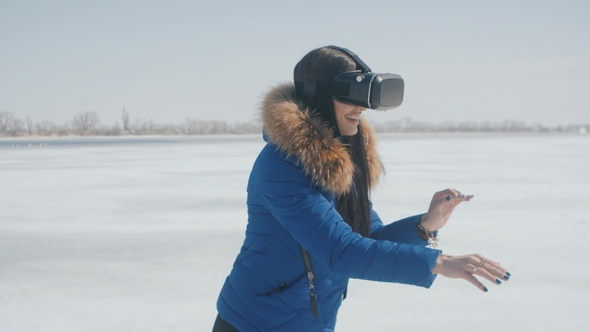 Portrait of Young Woman Getting Experience in Using VR-headset Outdoor ...