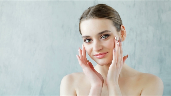 Beautiful Young Woman with Clean and Healthy Skin Posing on Grey ...