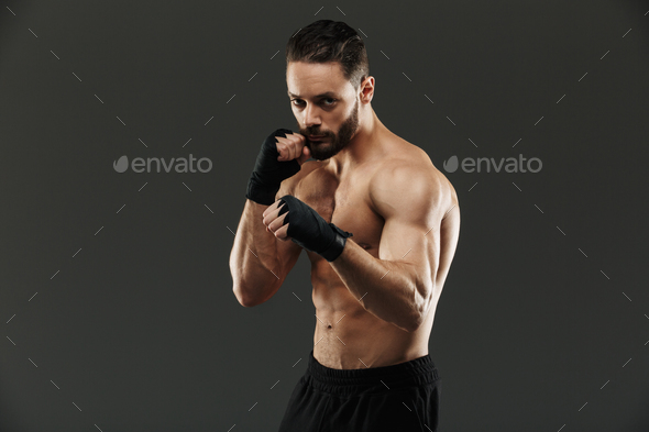 Portrait of a concentrated muscular boxer ready to fight Stock Photo by ...