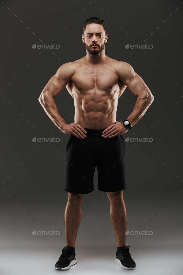 Full length portrait of a motivated muscular man posing Stock Photo by ...