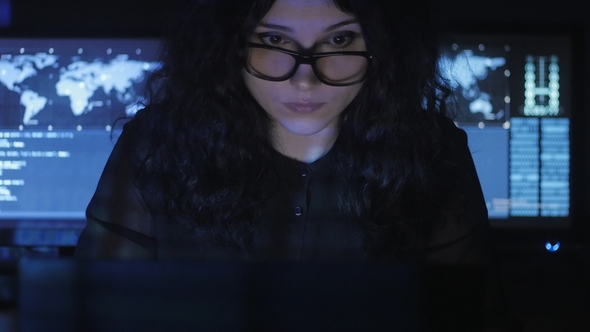 Bespectacled Woman Hacker Programmer Is Working on Computer, Stock Footage